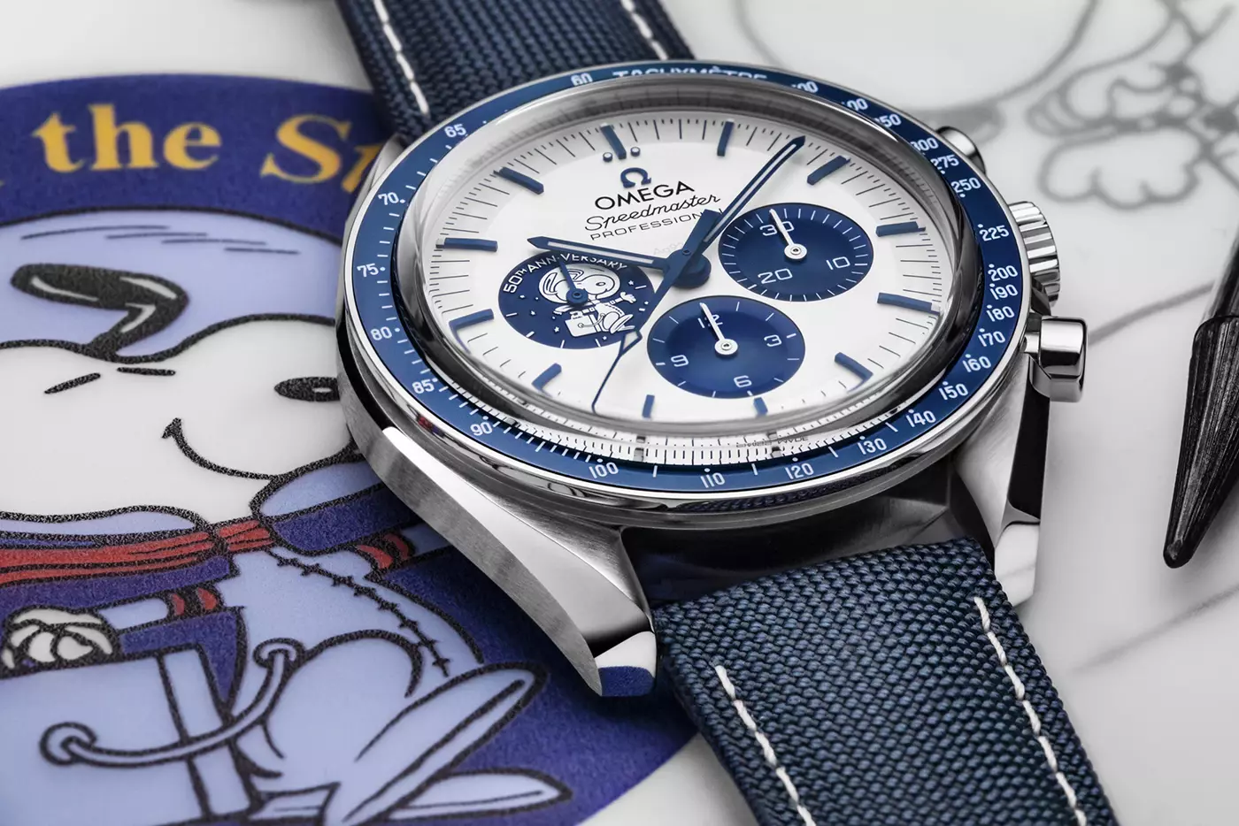 Омега Күміс Snoopy сыйлығының 50 жылдық мерейтойын жаңа Speedmaster Moonwatch көмегімен атап өтті. 7657_1